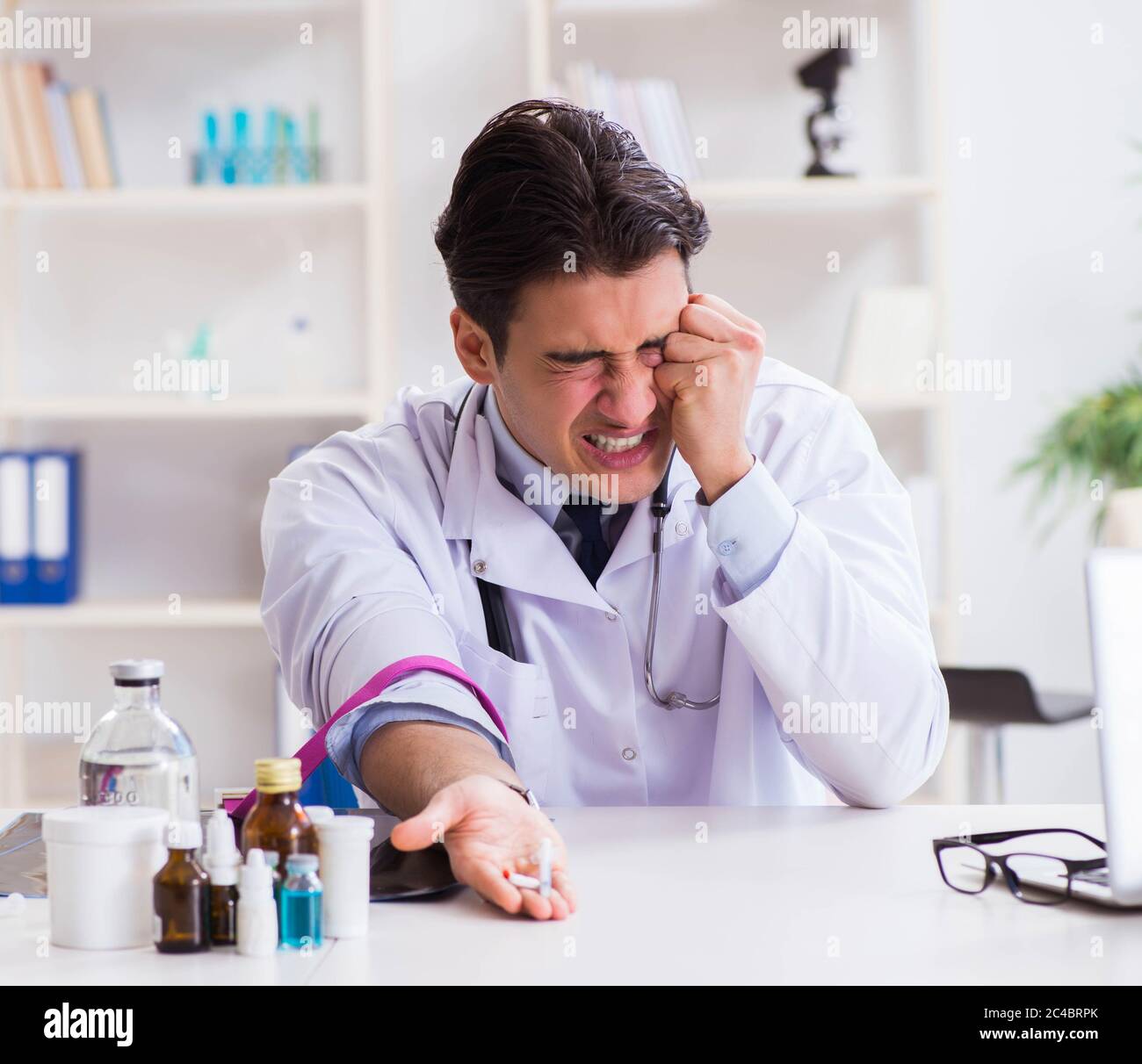The doctor drug addict in the hospital Stock Photo - Alamy