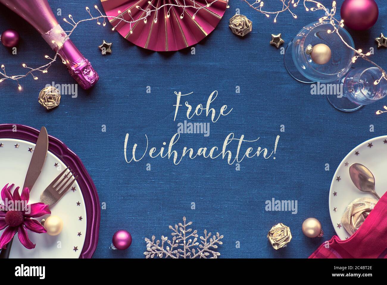 Text Frohe Weihnachten means Merry Christmas in German. Christmas table ...