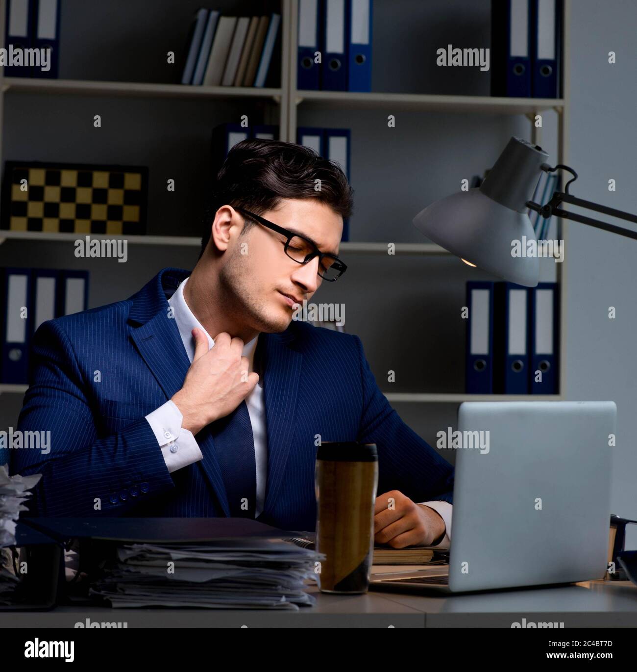 The employee working late to finish important deliverable task Stock ...