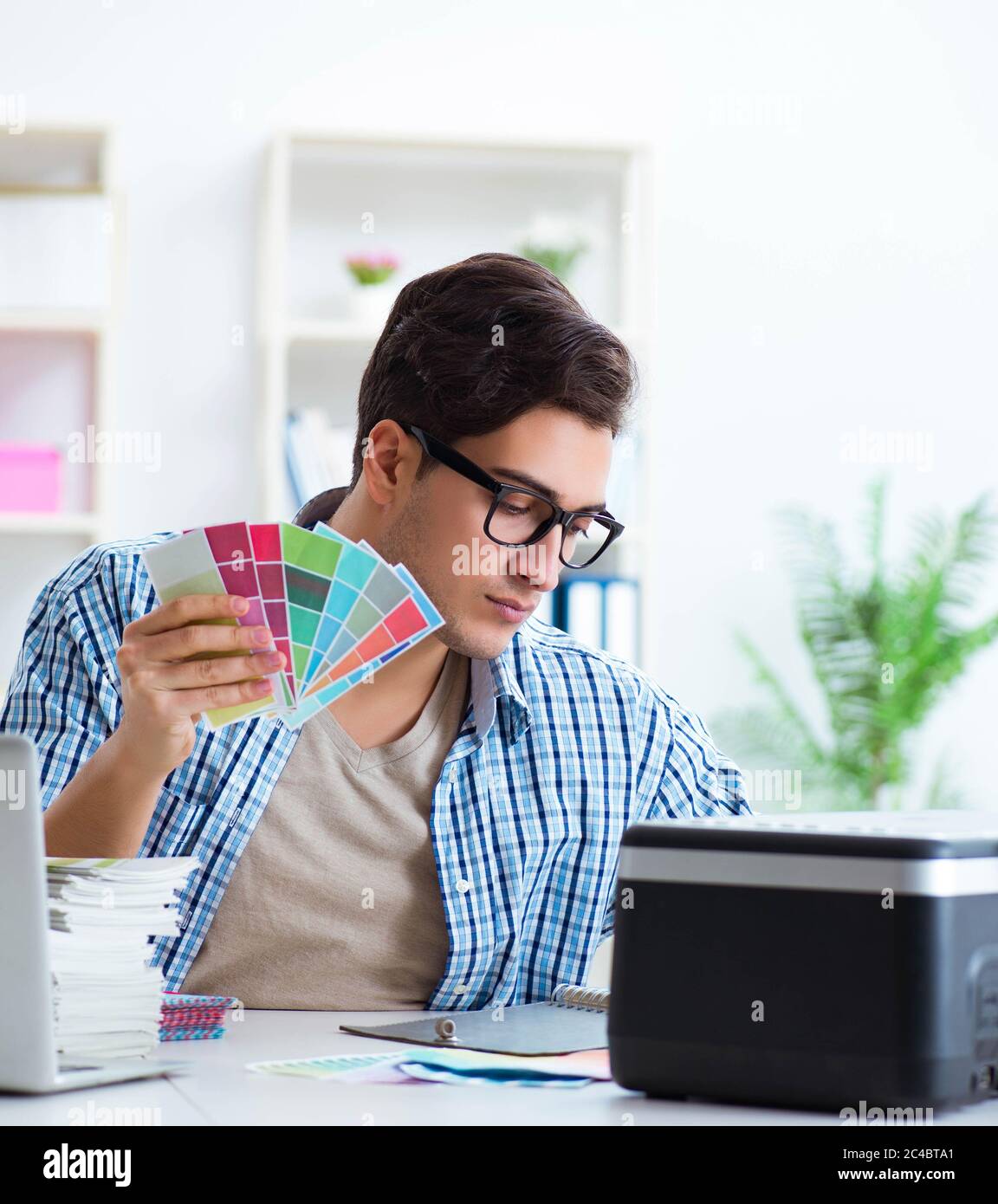 The young designer choosing colours for new project Stock Photo - Alamy