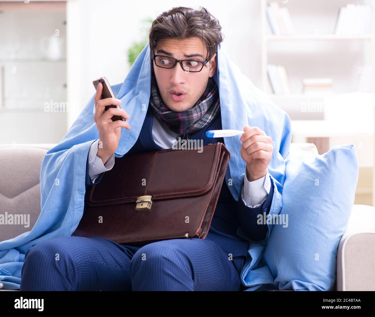 The sick employee staying at home suffering from flue Stock Photo - Alamy