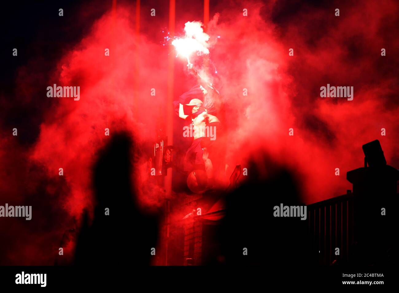 Liverpool fans let off flares outside Anfield, Liverpool Stock Photo ...