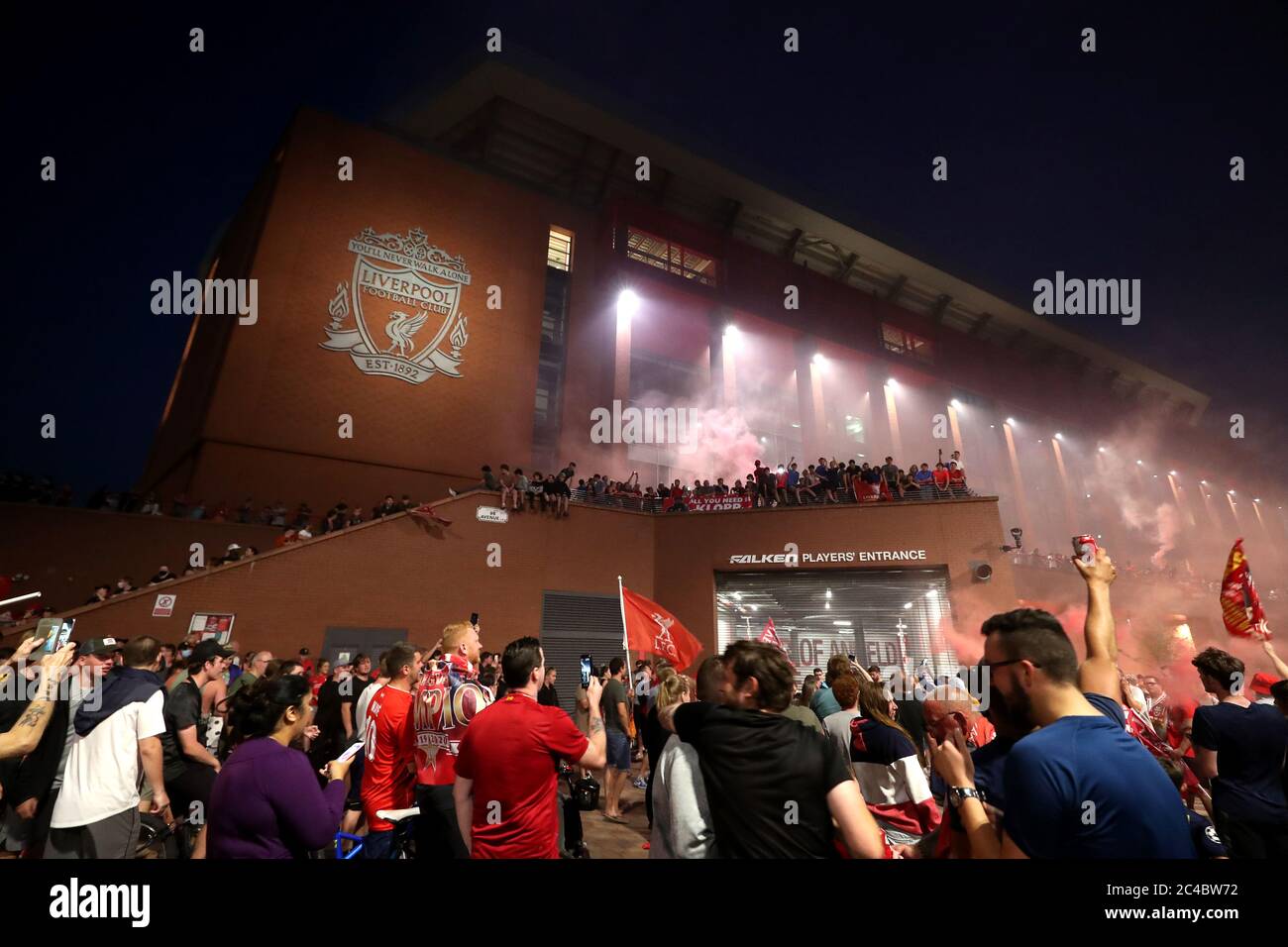 Liverpool fans celebrate outside Anfield, Liverpool Stock Photo - Alamy