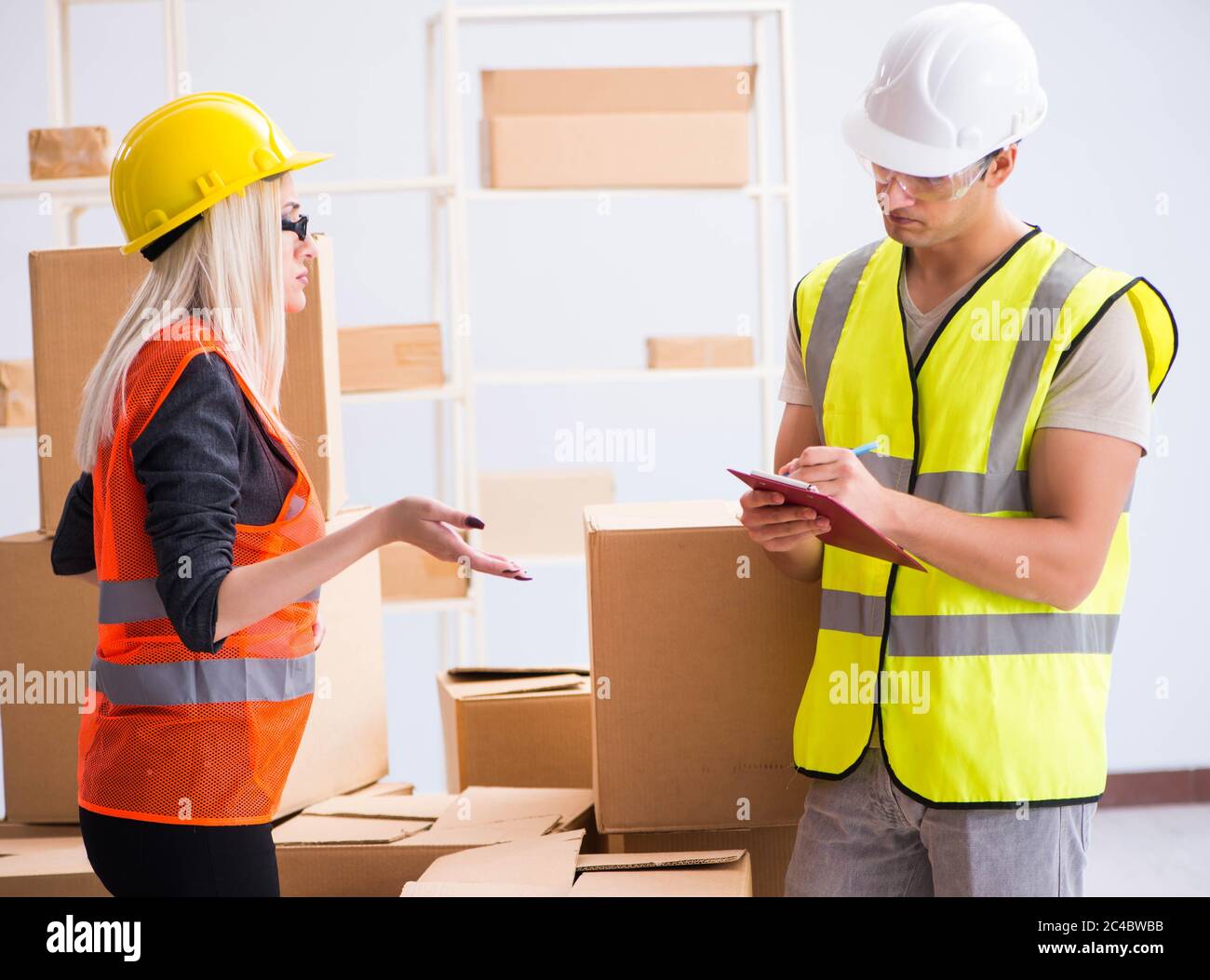 The delivery contractor delivering boxes to office Stock Photo - Alamy