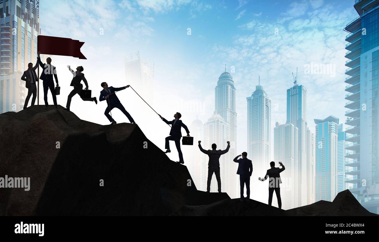 Concept of teamwork with team climbing mountain Stock Photo - Alamy