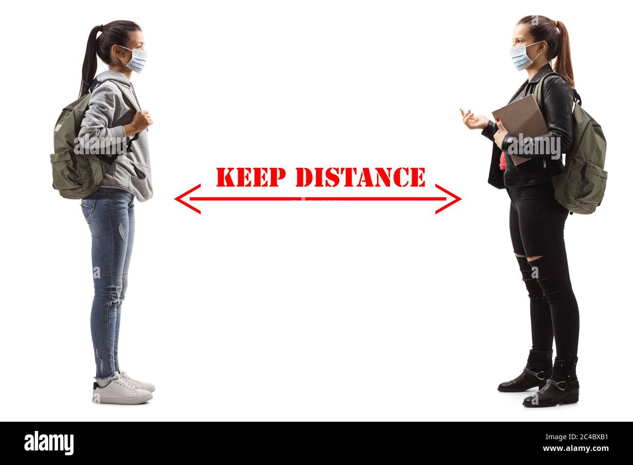 Full length profile shot of two young female students with protective ...