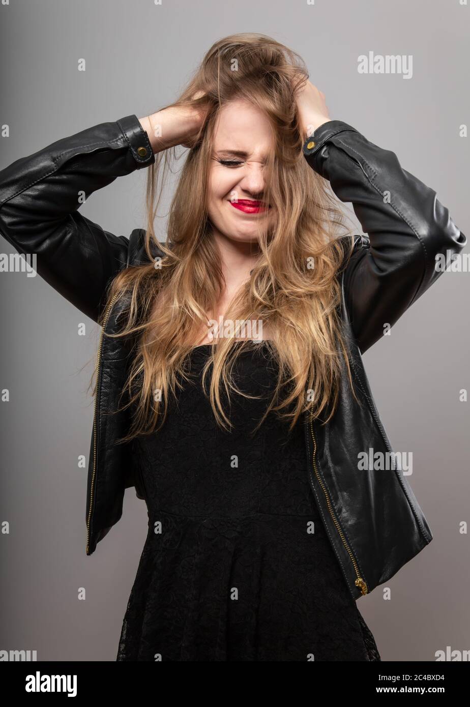 Tired from work makeup female model with agressive emotions grimacing ...