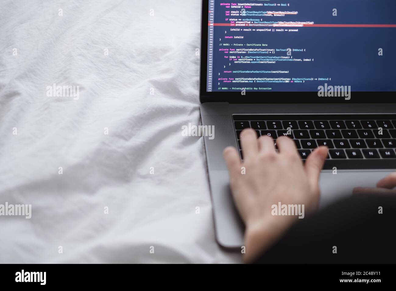 Female programmer writes code on hi-res stock photography and images ...