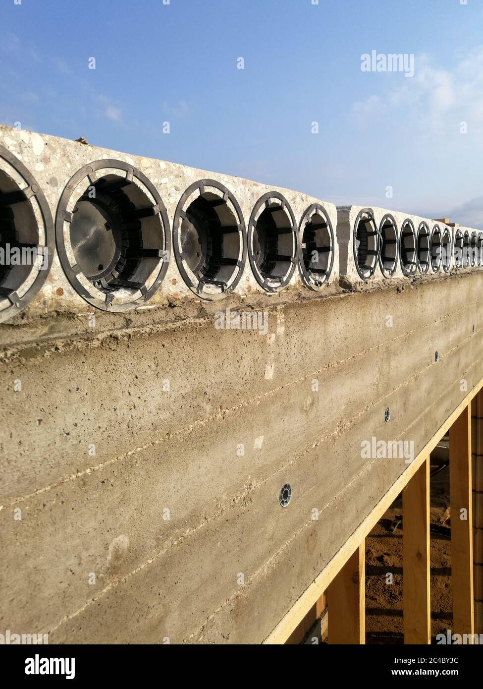 Concrete hollow core slabs close up at constructions site. Construction ...
