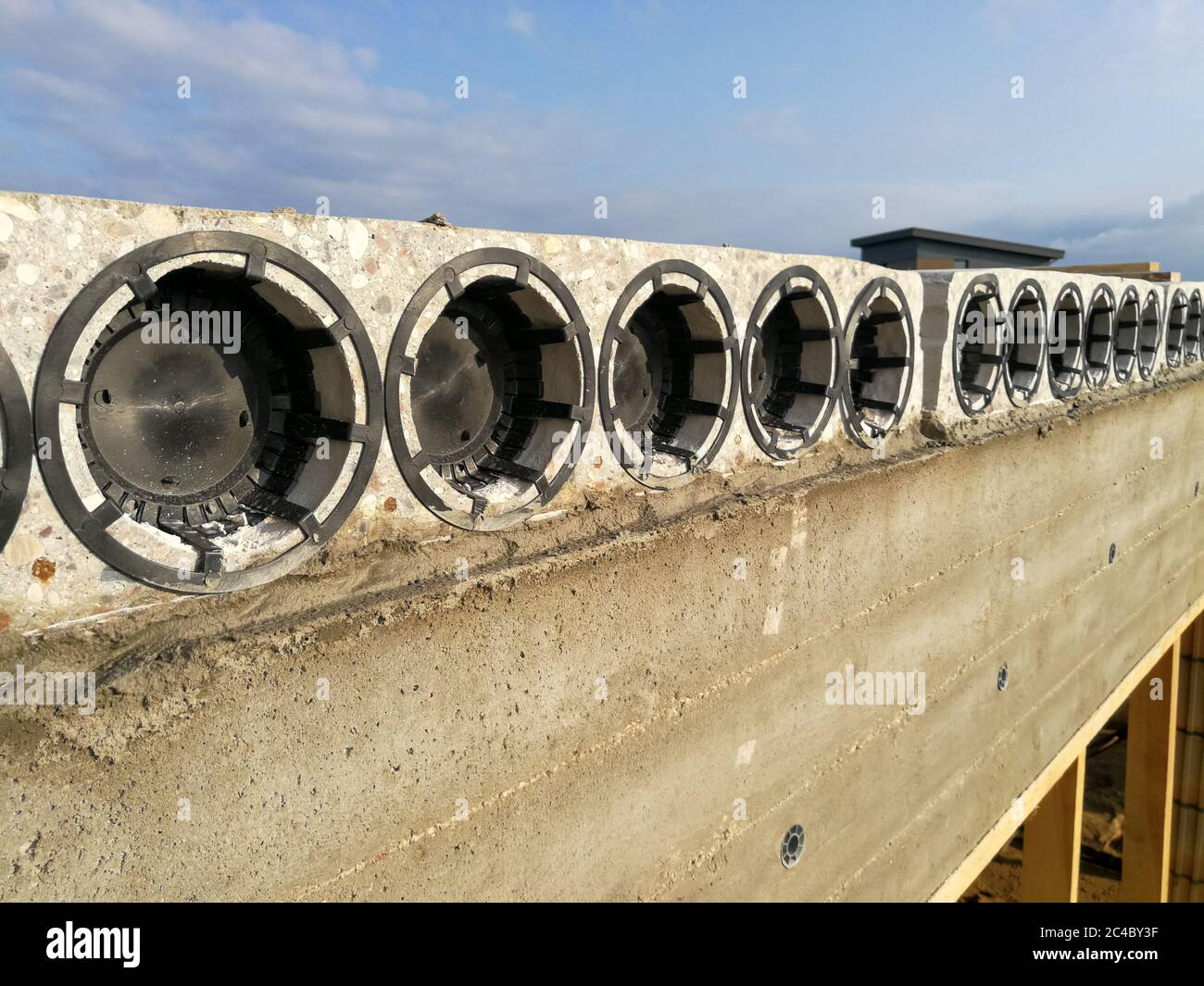 Concrete hollow core slabs close up at constructions site. Construction ...