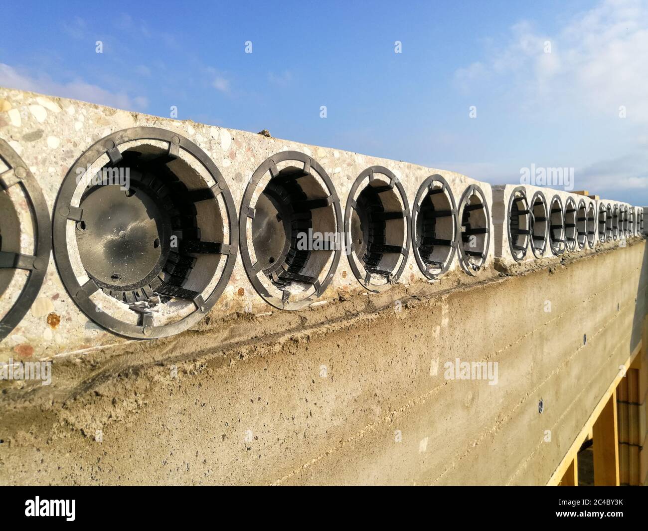 Concrete hollow core slabs close up at constructions site. Construction ...