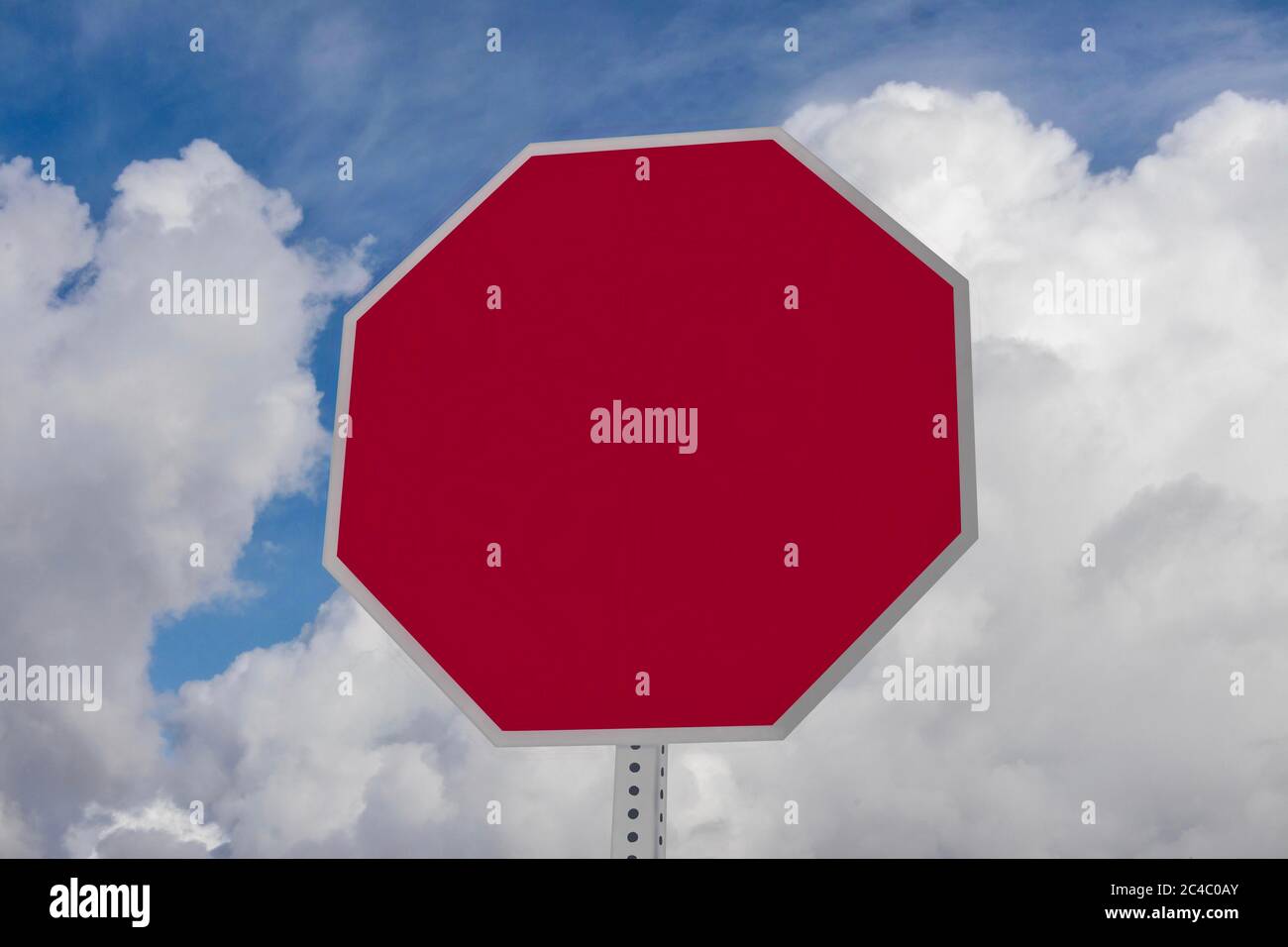 Blank Stop sign against blue sky with clouds Stock Photo - Alamy