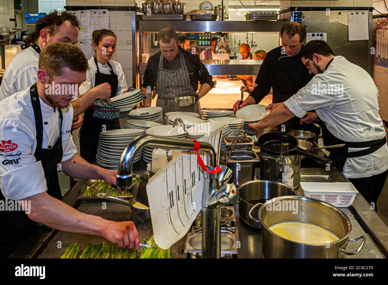 German Michelin Star Chef Klaus Erfort working in line with kitchen ...