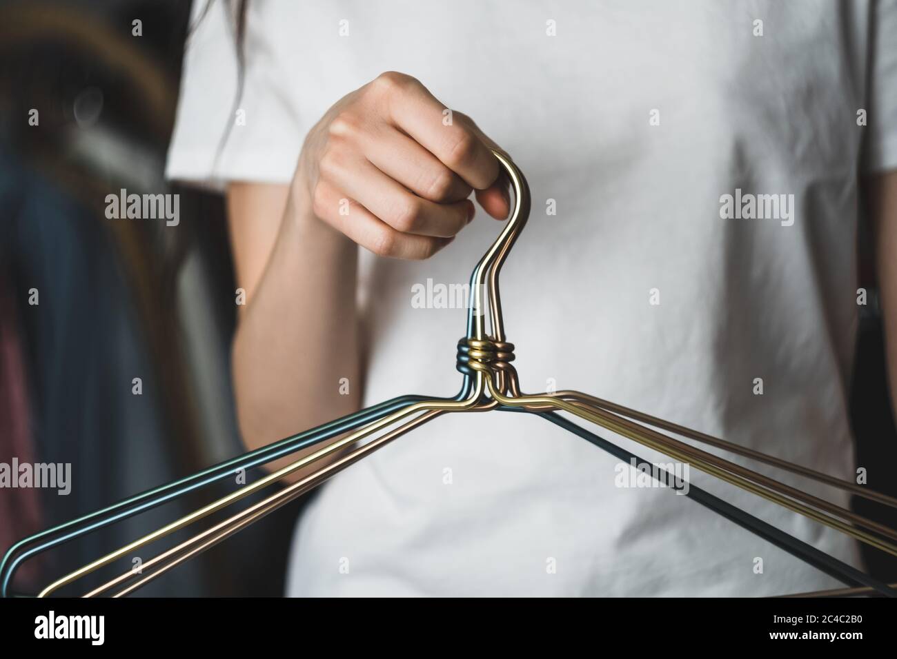 Woman holds up cloth hi-res stock photography and images - Alamy