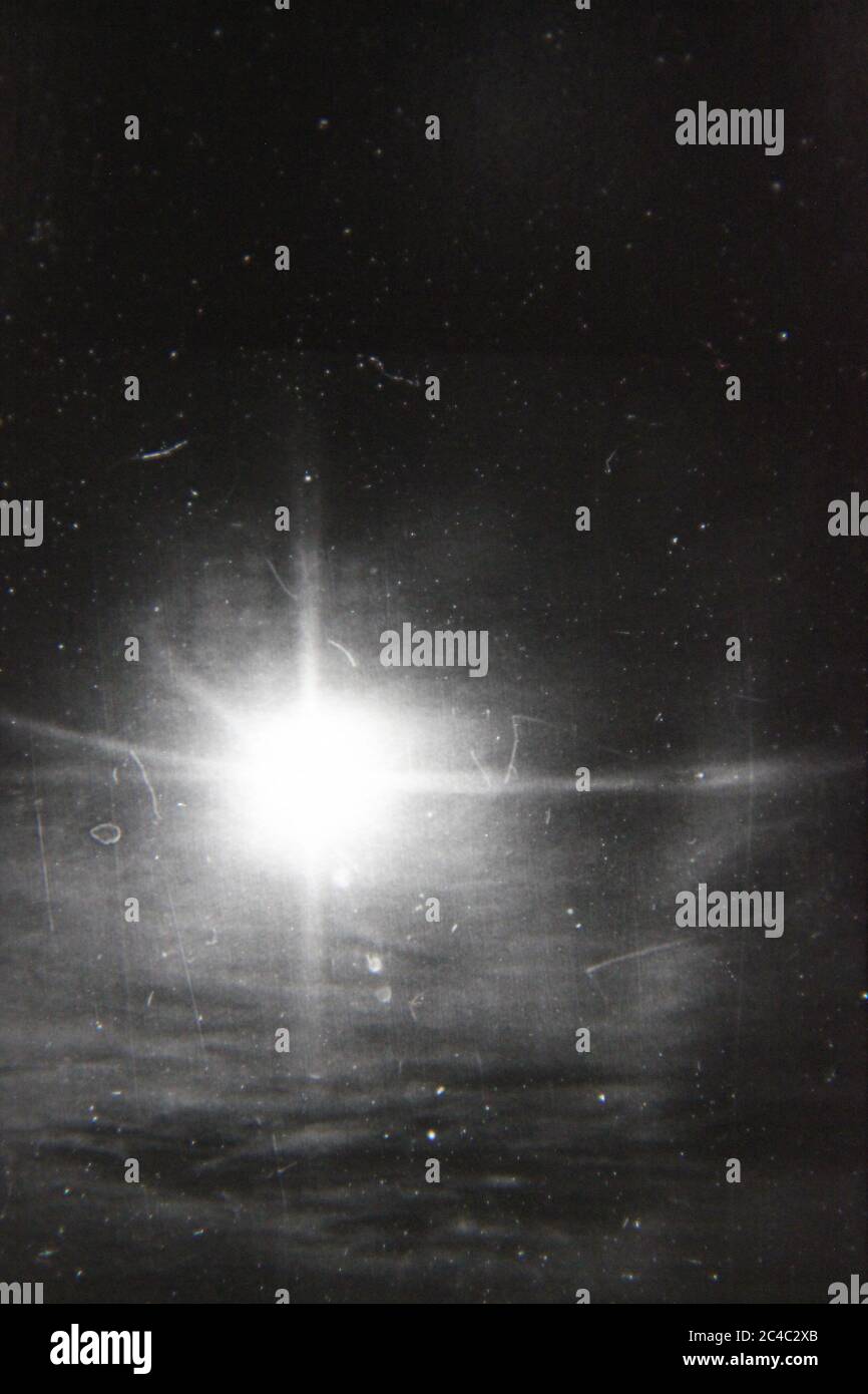 Fine 1970s black and white photography of the bright sun shining high ...