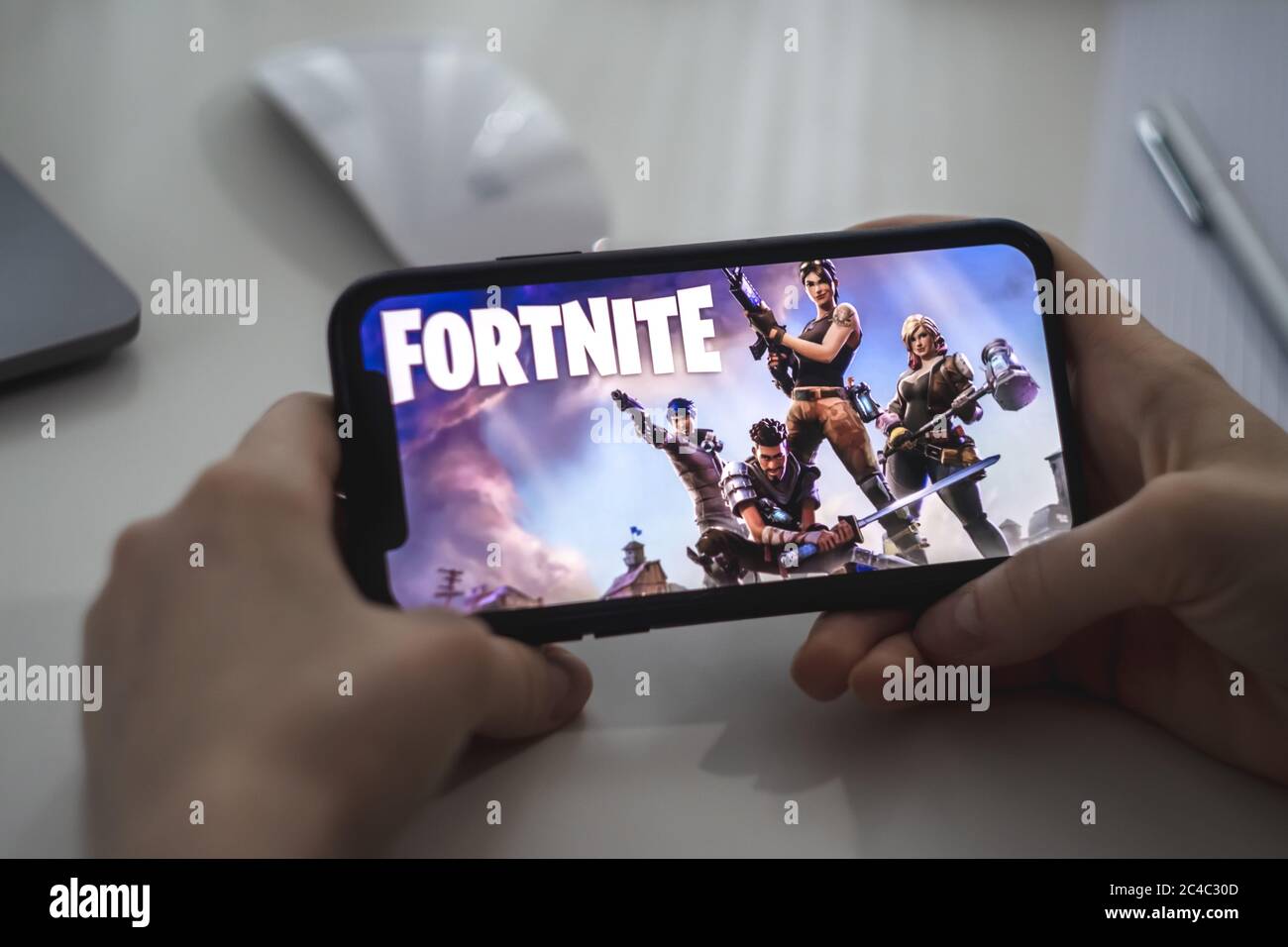 Fortnite game on the iPhone screen Stock Photo - Alamy