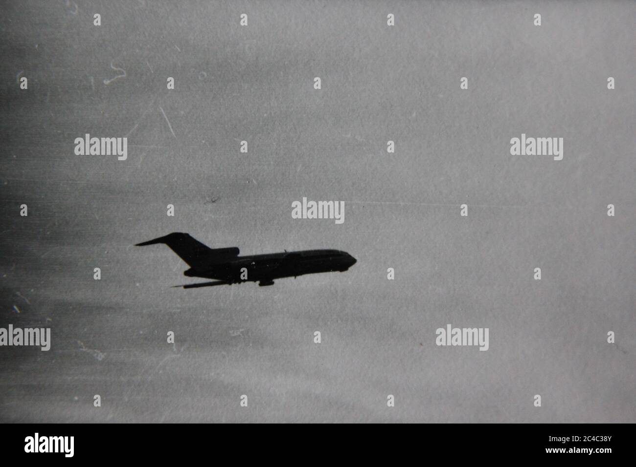 Fine 70s vintage contact print black and white photography of a jet plane flying thru the air ...
