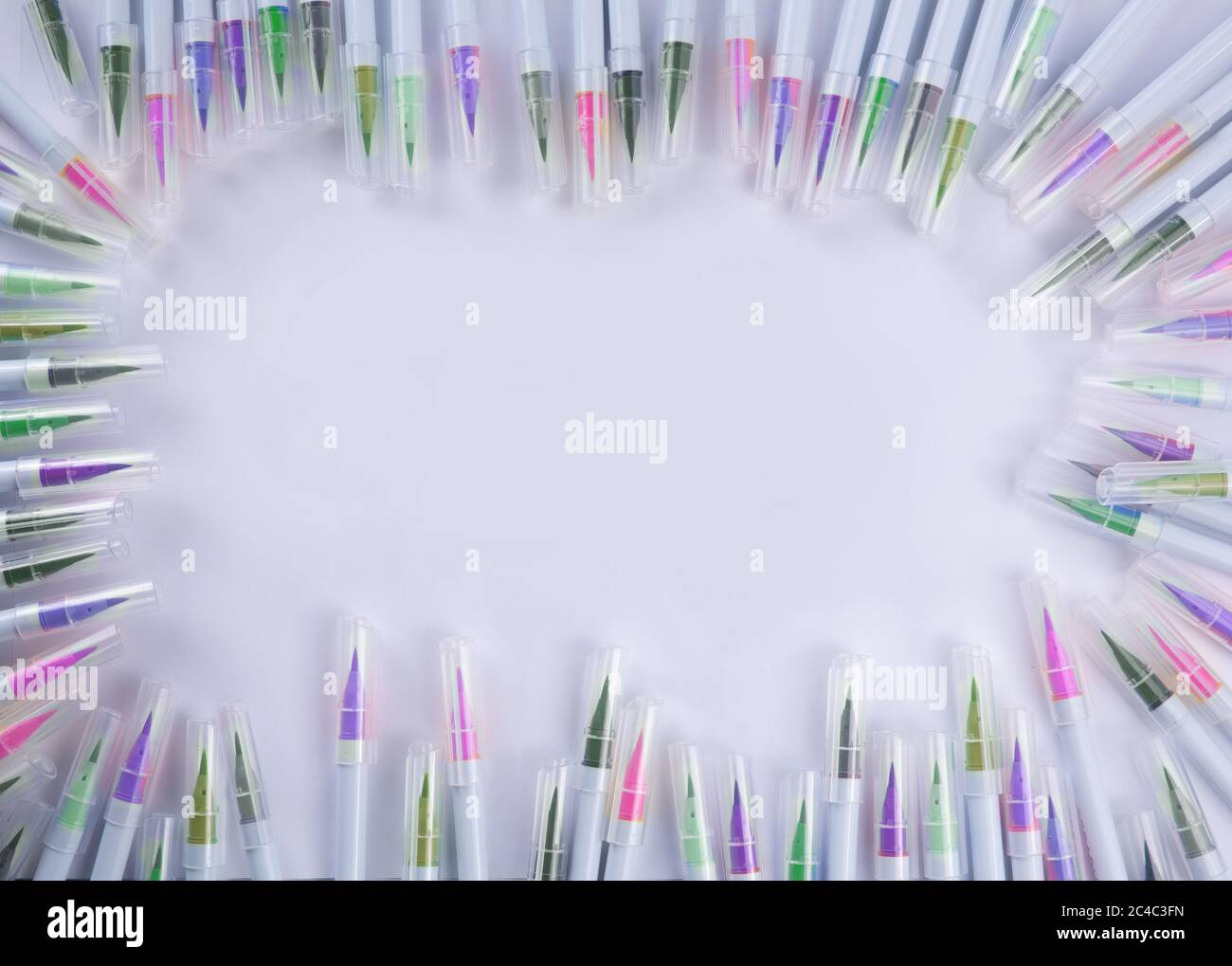 Frame made of many pens and markers of different colors Stock Photo - Alamy