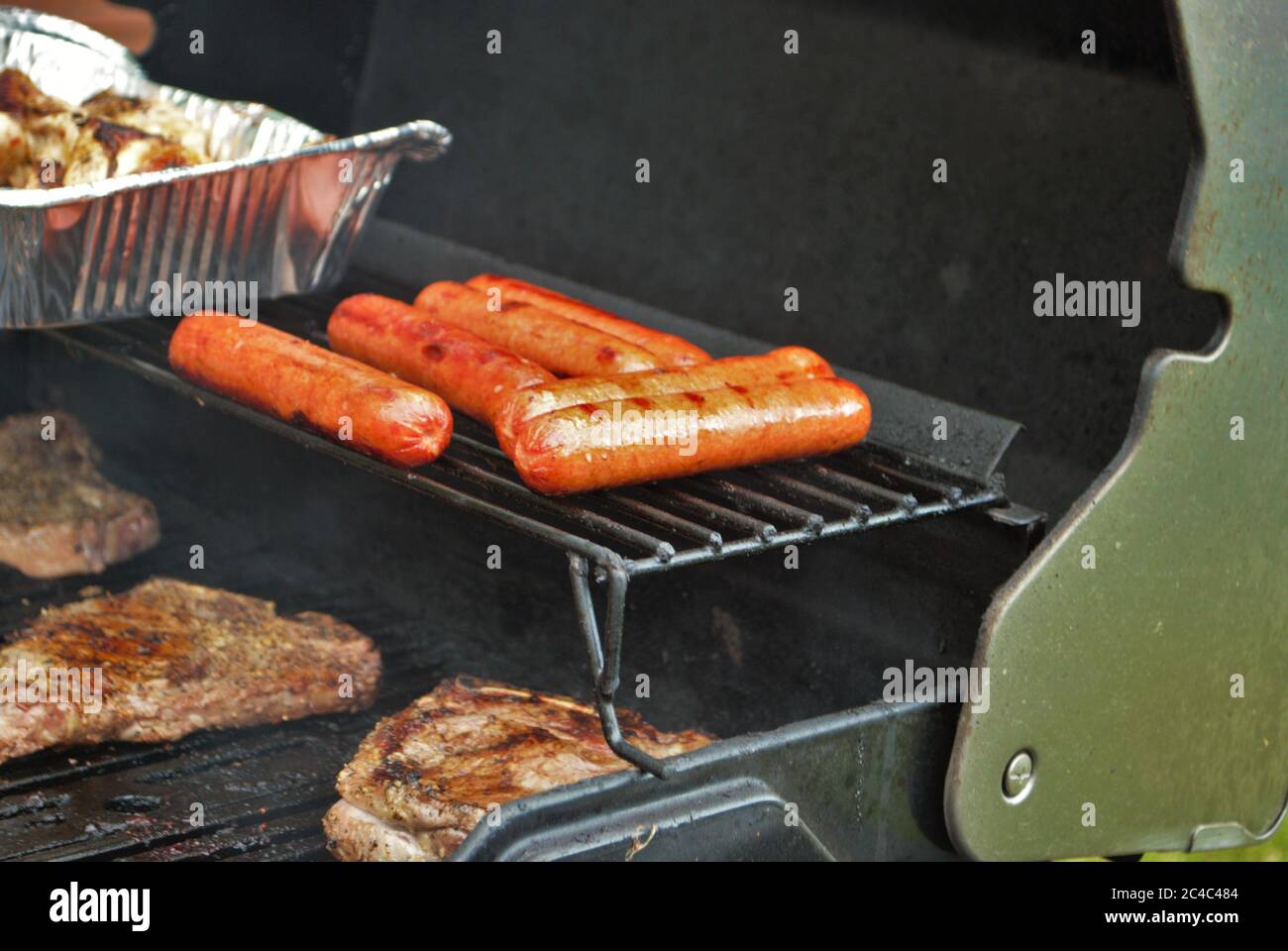 food on the grill at a backyard cookout Stock Photo - Alamy
