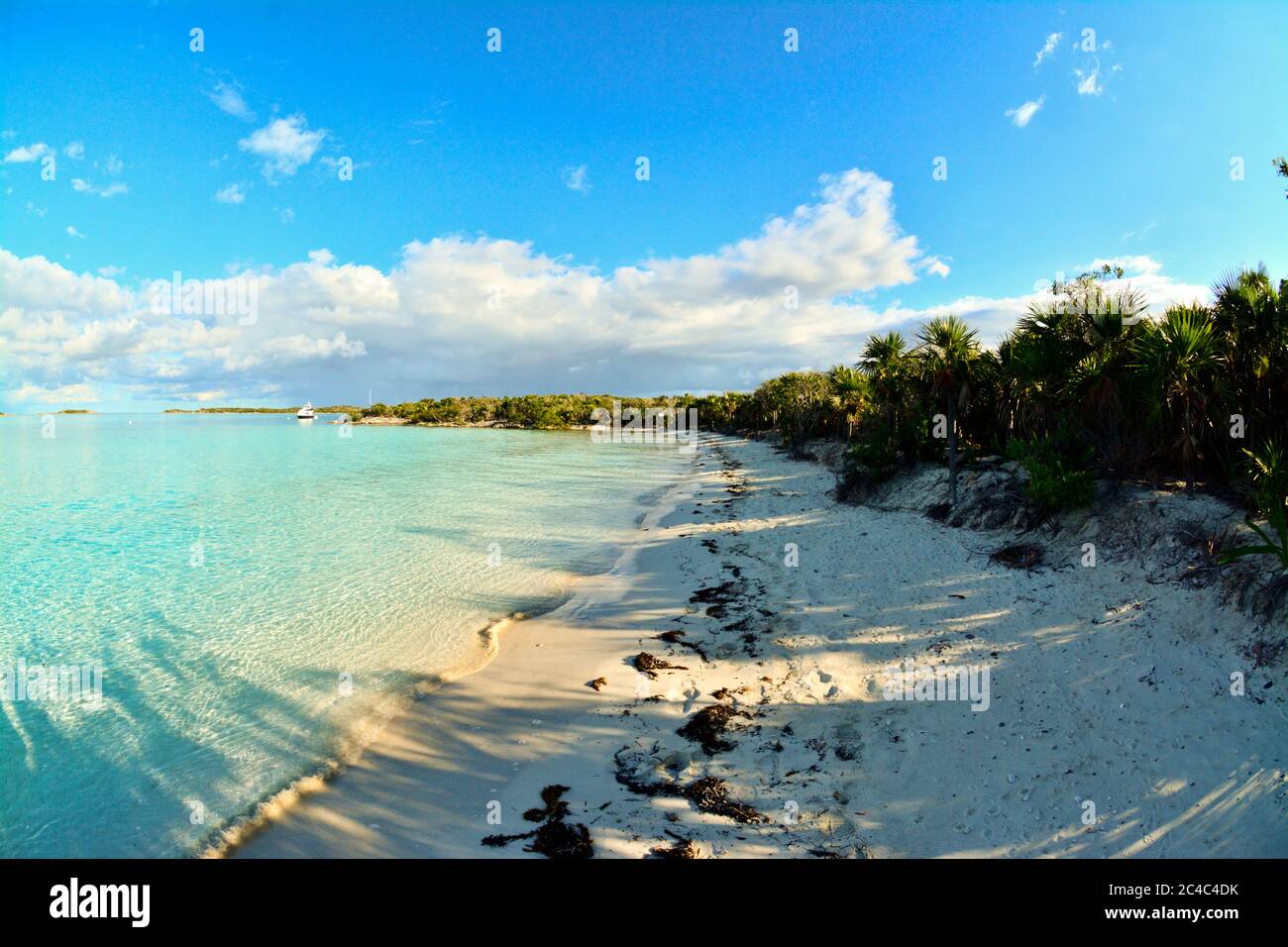 Bahamas Beach with sun shades in the afternoon Stock Photo - Alamy