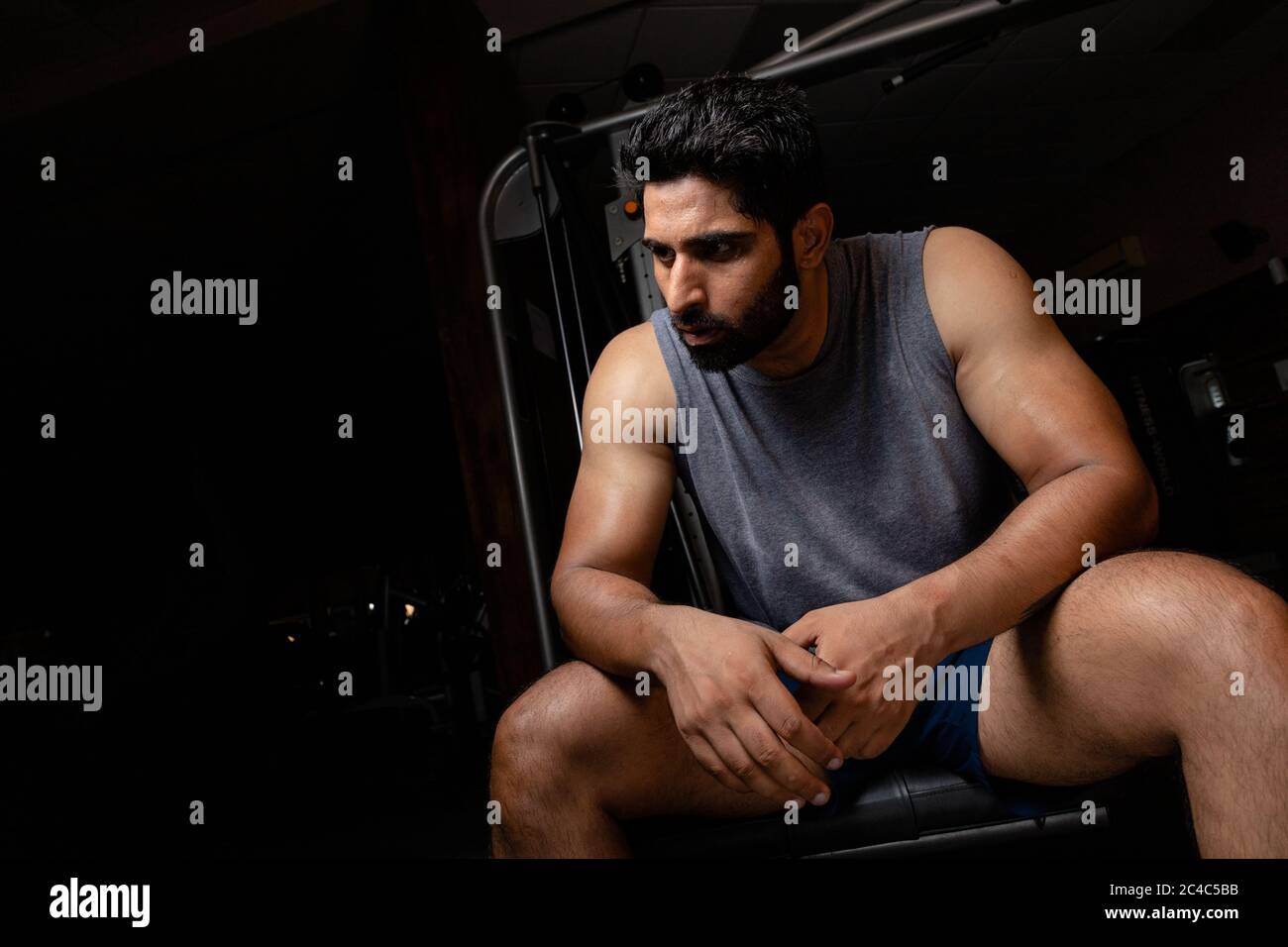 Athlete sitting on table after heavy workout and full on sweating Low ...