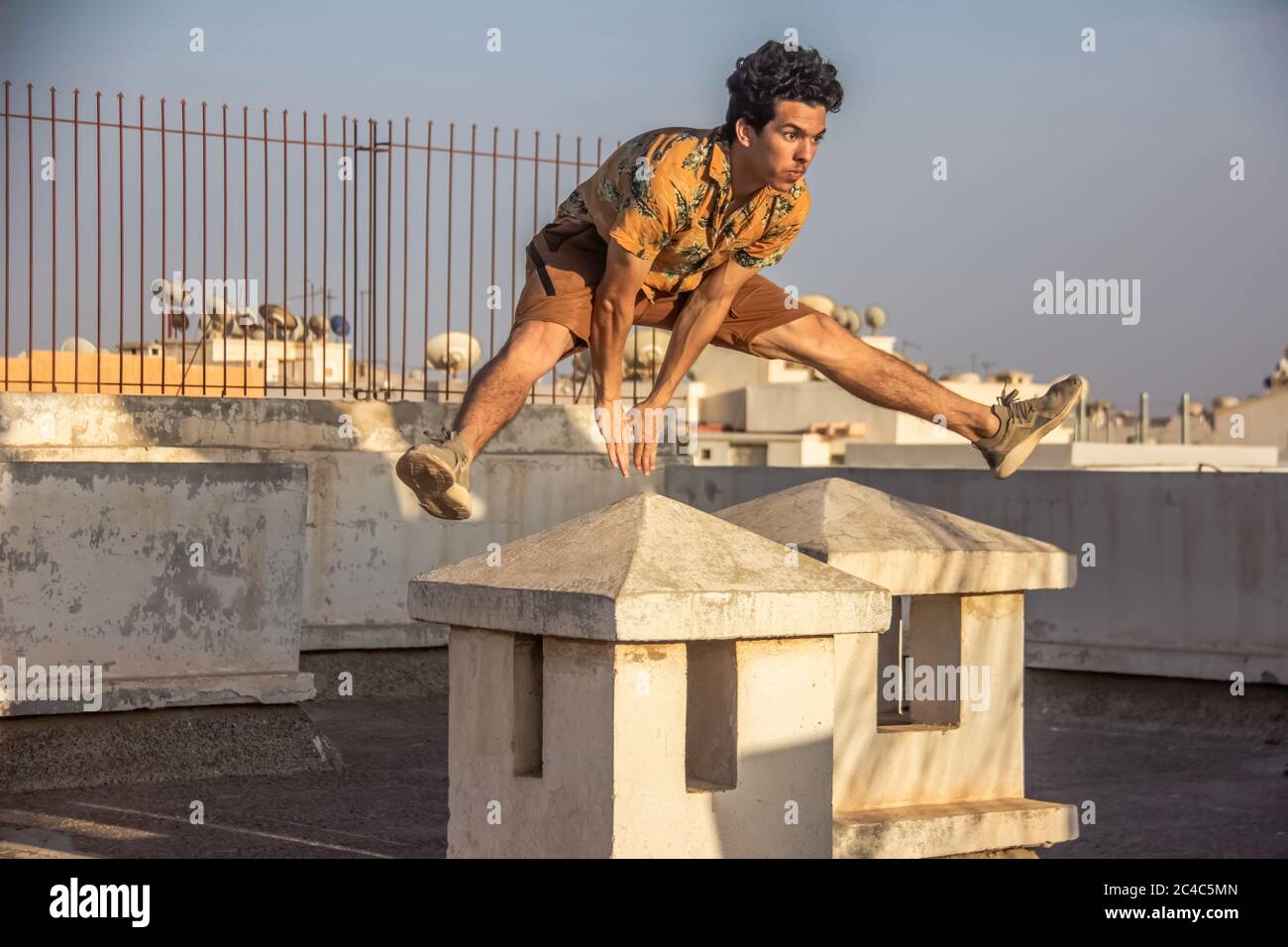 Moroccan parkour athlete playing parkour on the rooftop Stock Photo - Alamy Moroccan parkour athlete playing parkour on the rooftop Stock Photo - Alamy