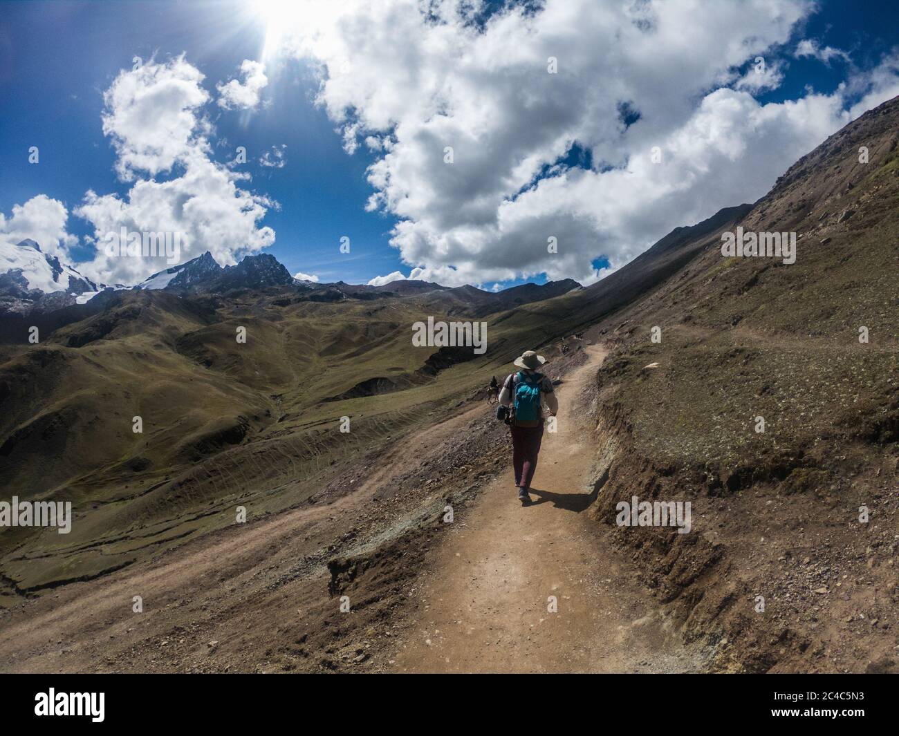 Walking man mountains sun hi-res stock photography and images - Alamy
