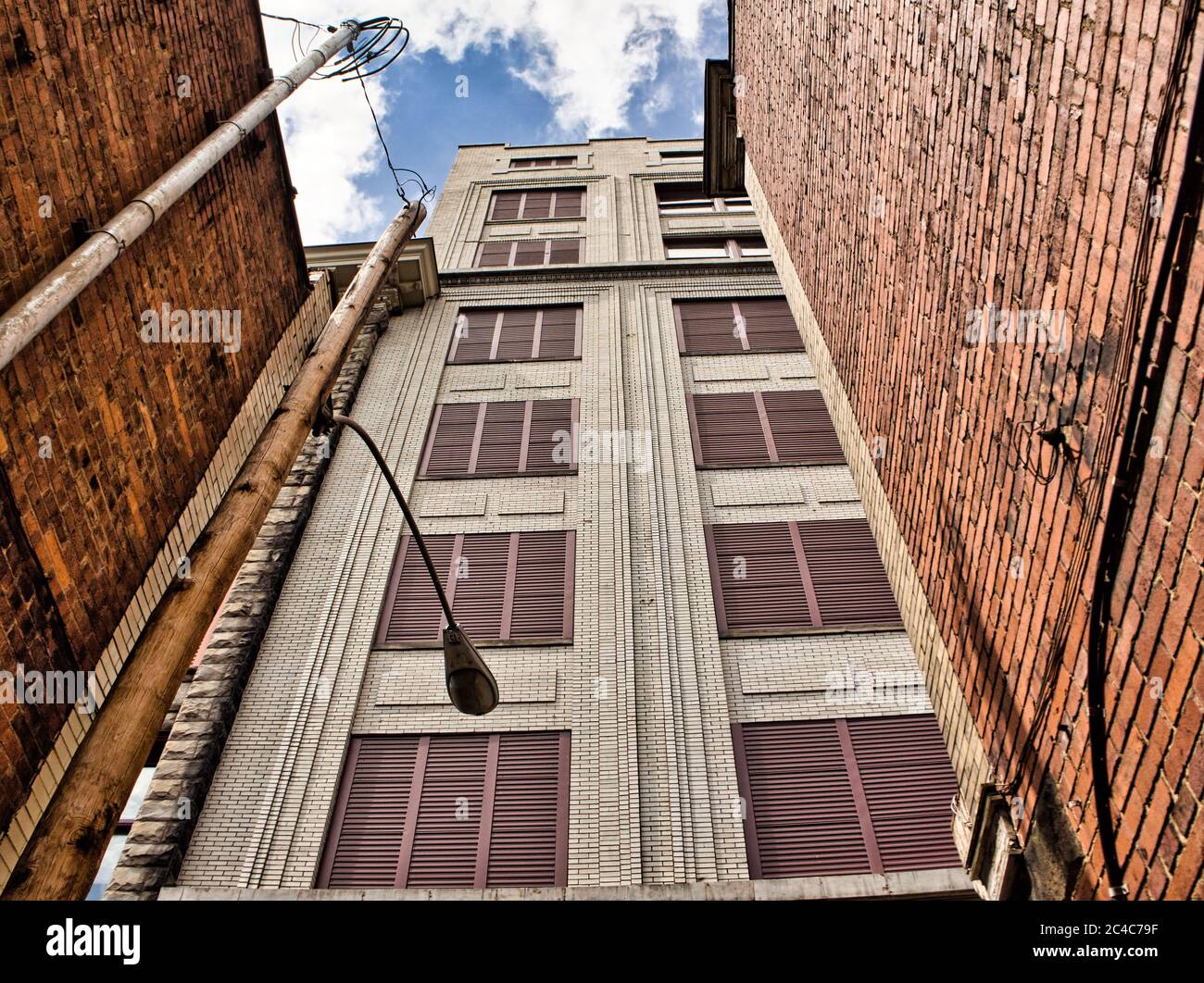 Narrow alley between 2 brick buildings Stock Photo - Alamy