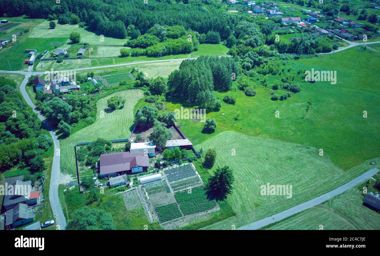 Aerial view of countryside in summer. Bird's eye view of village in ...