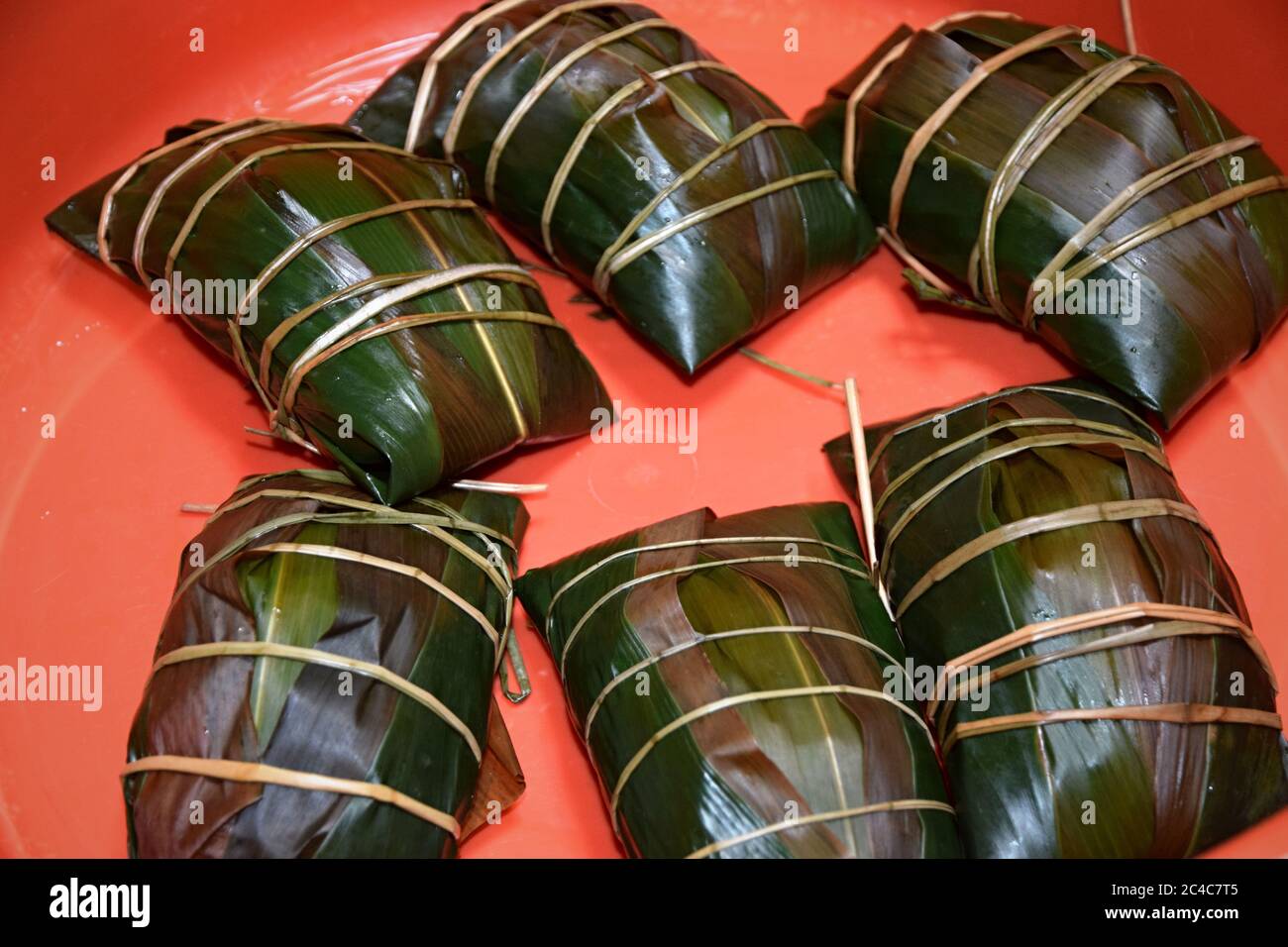 Zongzi is a traditional Chinese rice dish made of glutinous rice ...