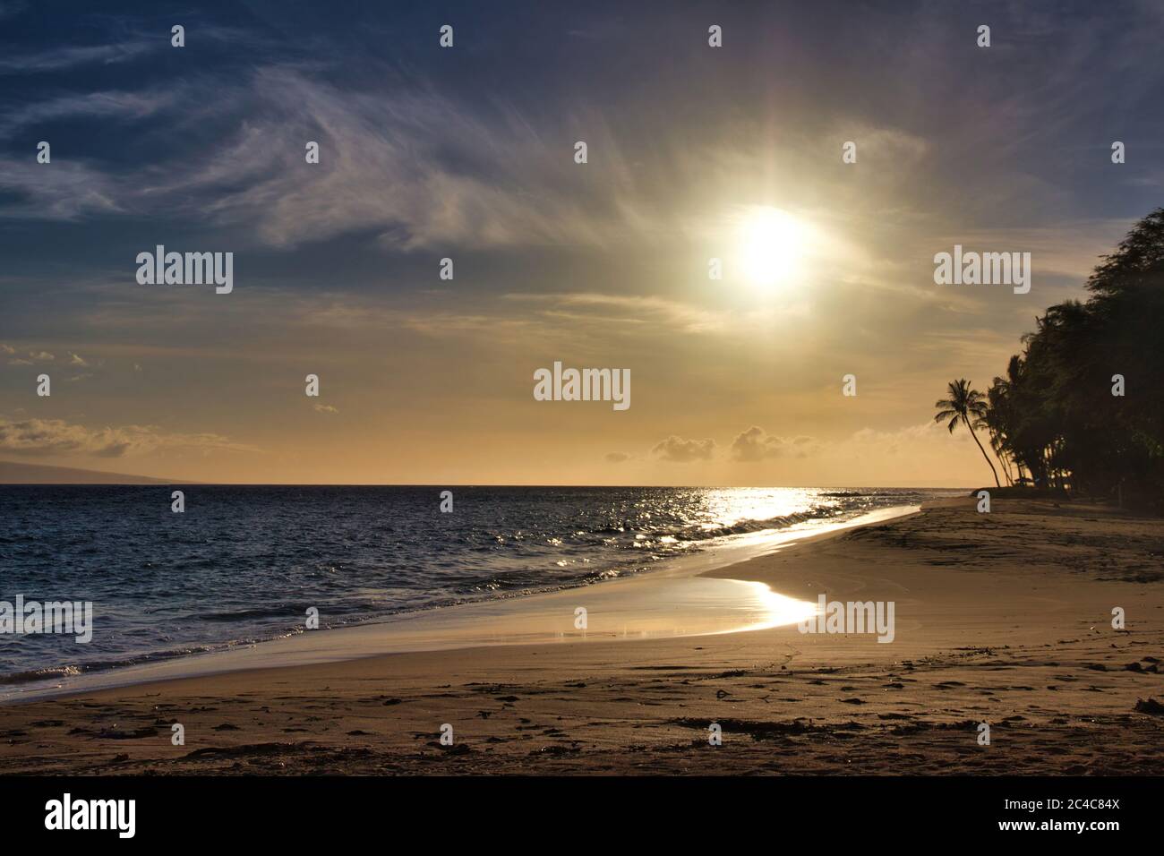 Beautiful sunset on tropical Maui beach Stock Photo - Alamy