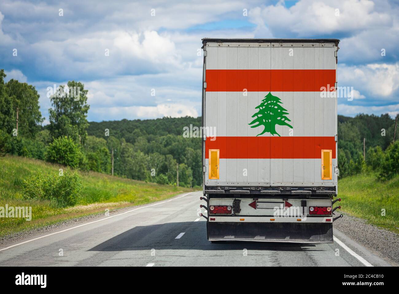 A truck with the national flag of Lebanon depicted on the back door ...
