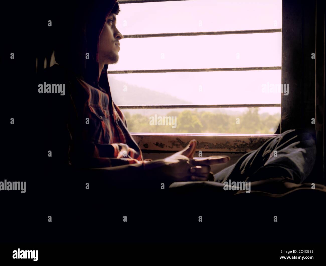 Thinking man in a moving train Stock Photo - Alamy