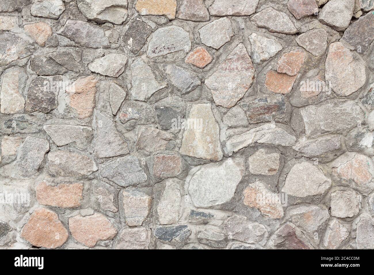 Chipped Stone Wall Background closeup Stock Photo - Alamy