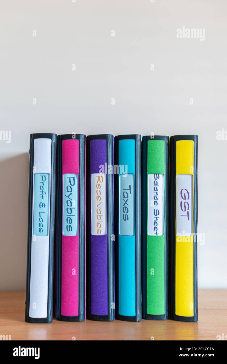 Set of color coded files and binders used by bookkeeper and accountant ...