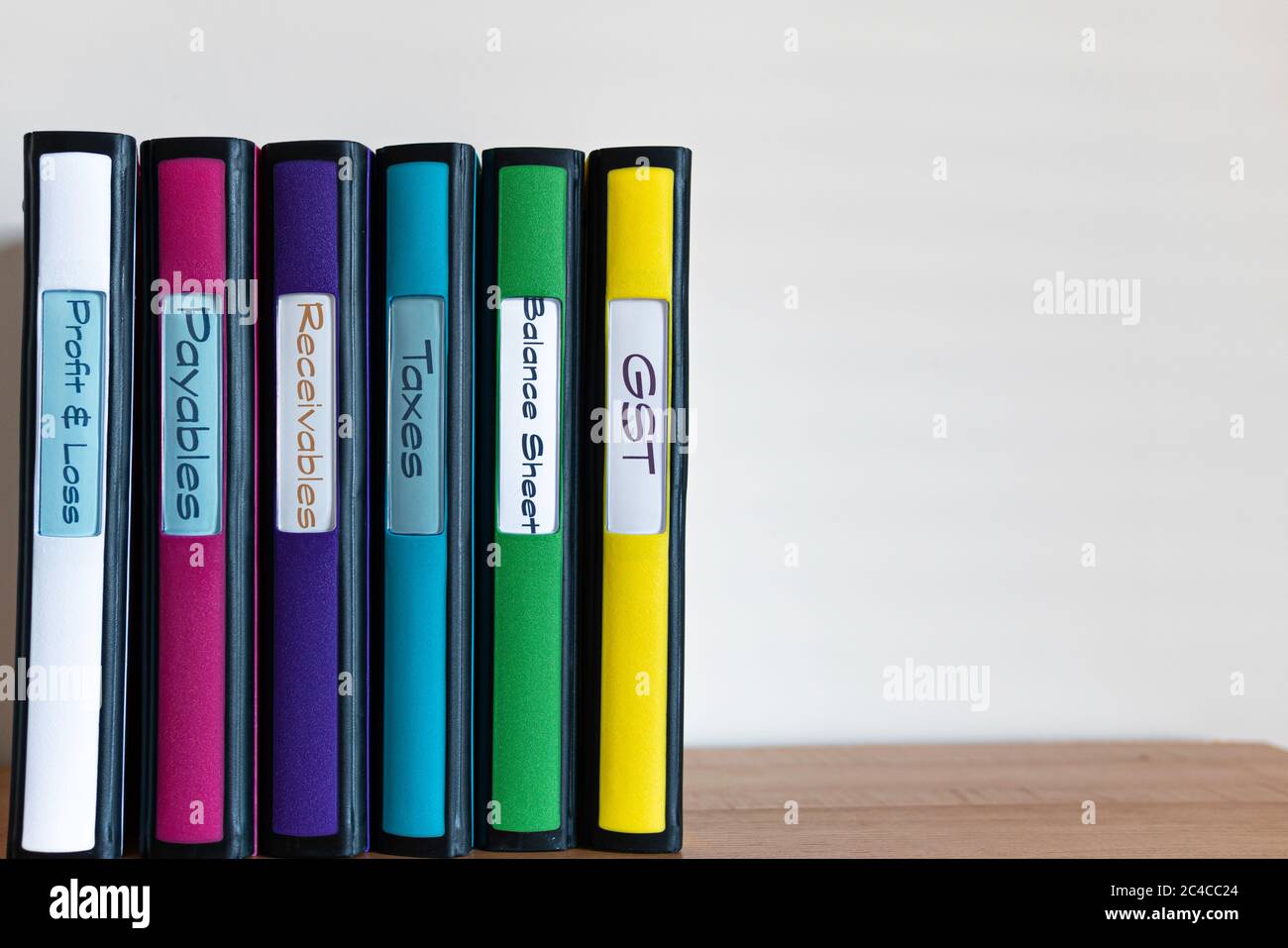 Set of color coded files and binders used by bookkeeper and accountant ...