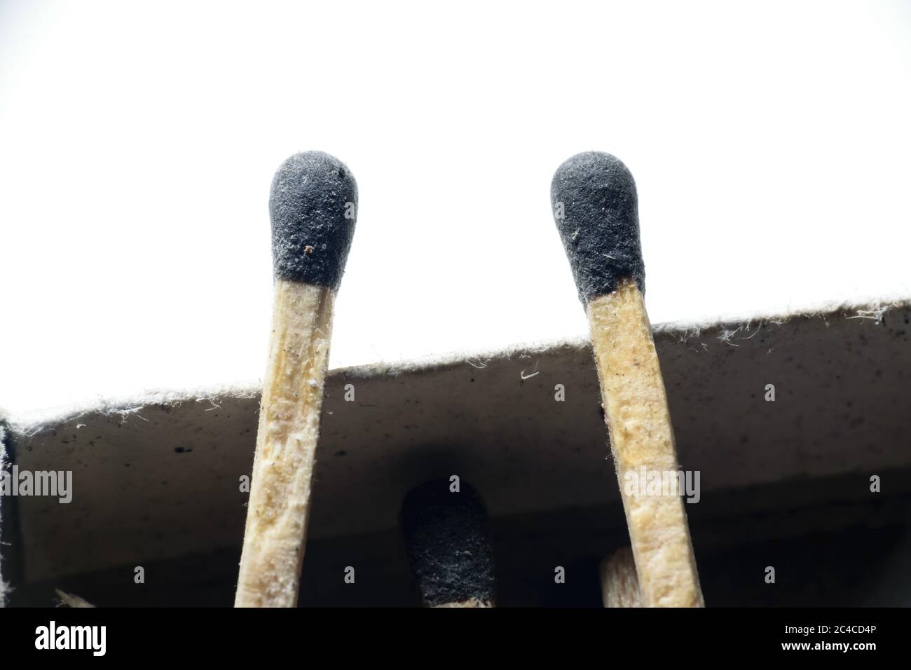 Two match sticks kept side by side in a white background Stock Photo ...