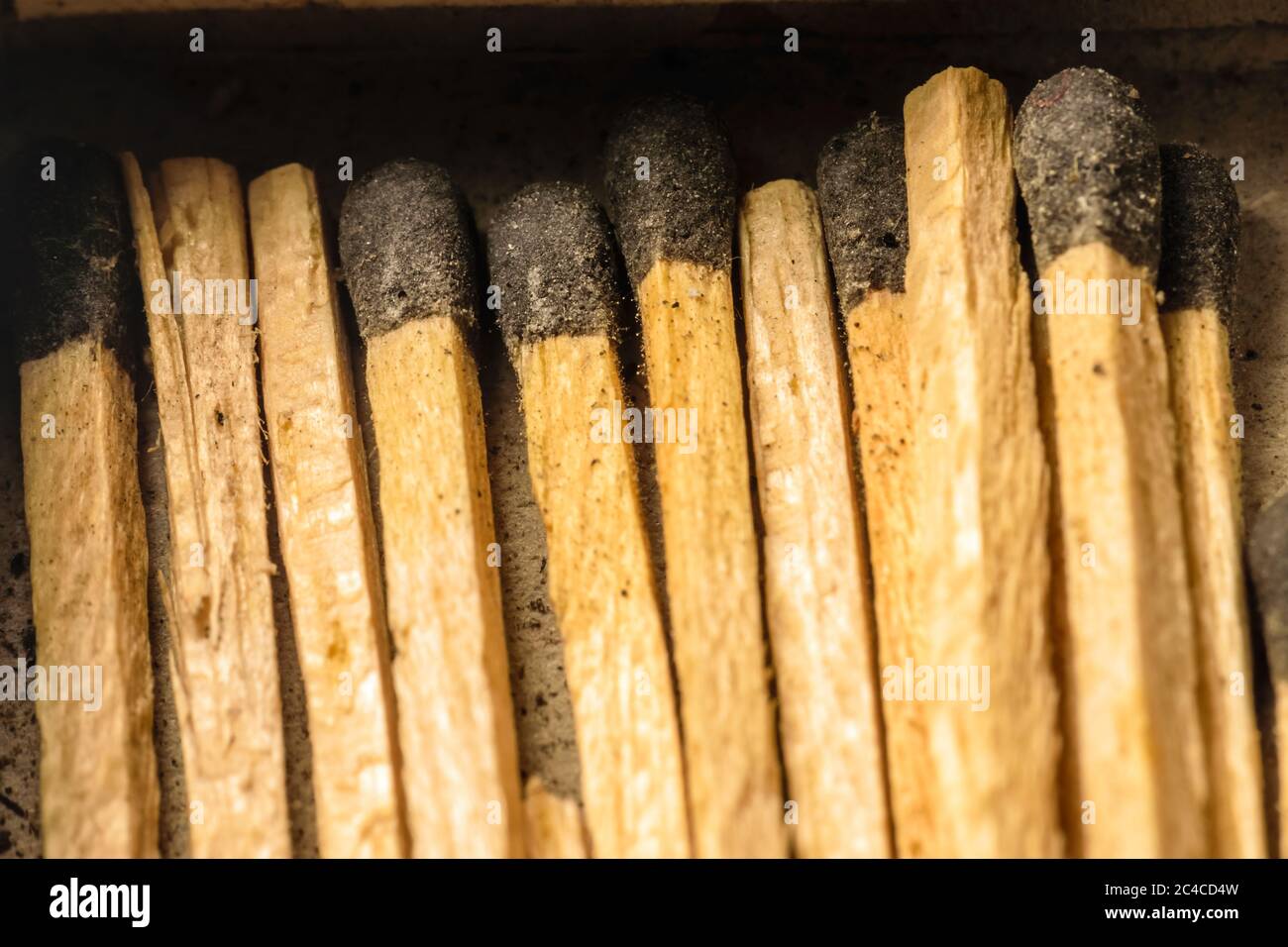 Match sticks are laying inside a match box in parallel Stock Photo - Alamy