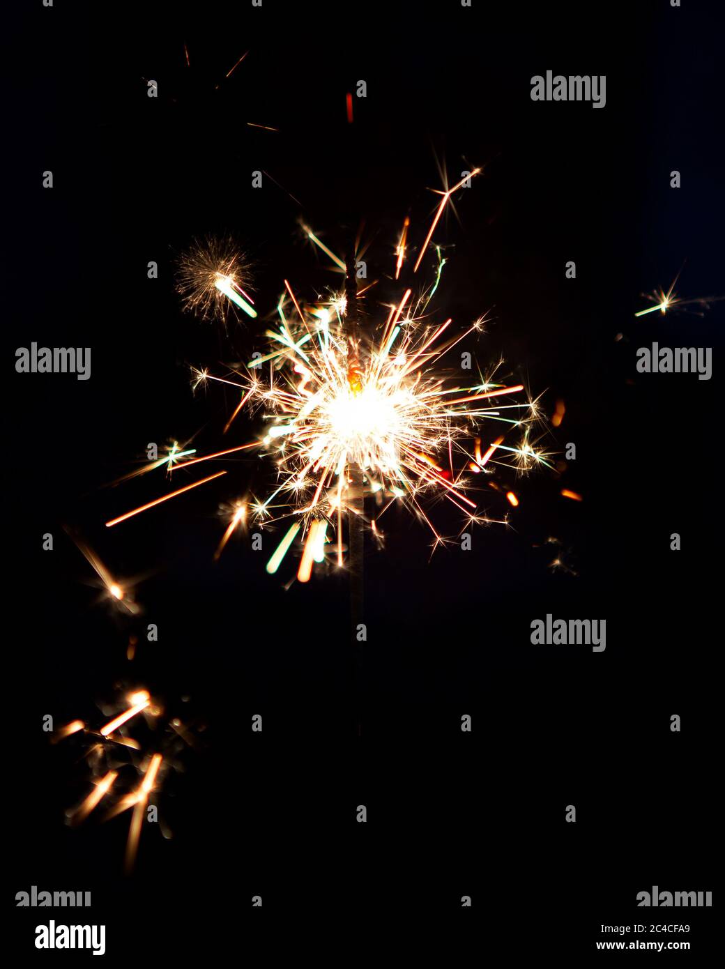 Lighting a Colorful Firework Sparkler In Celebration of the Holidays ...