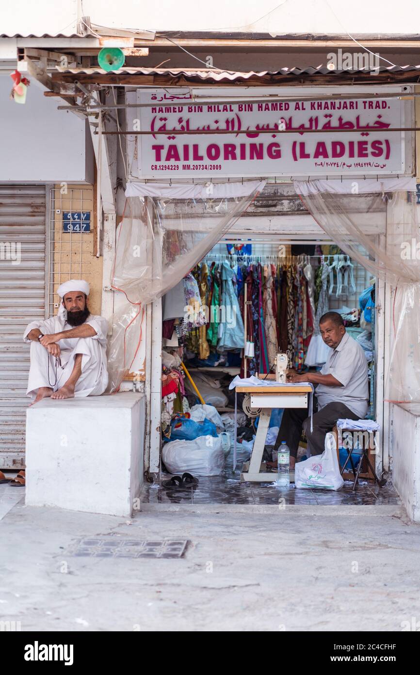Muscat / Oman - February 15, 2020: tailor sewing in small shop at ...