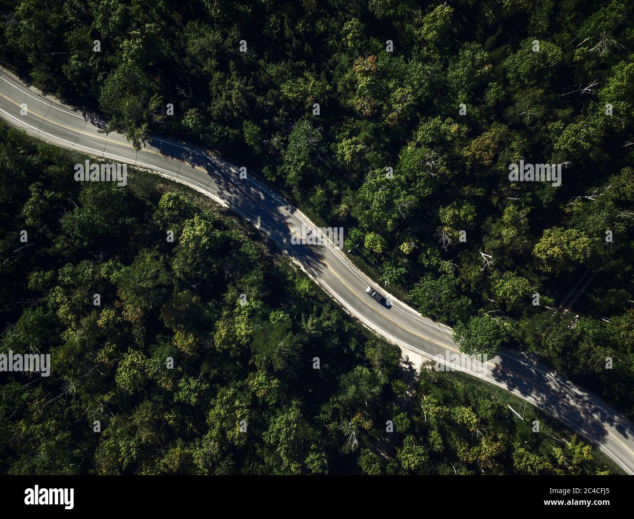 Car driving down winding road hi-res stock photography and images - Alamy