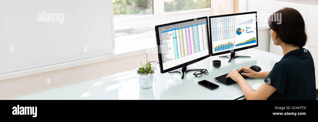 Analyst Employee Working With Spreadsheet On Computer Stock Photo - Alamy
