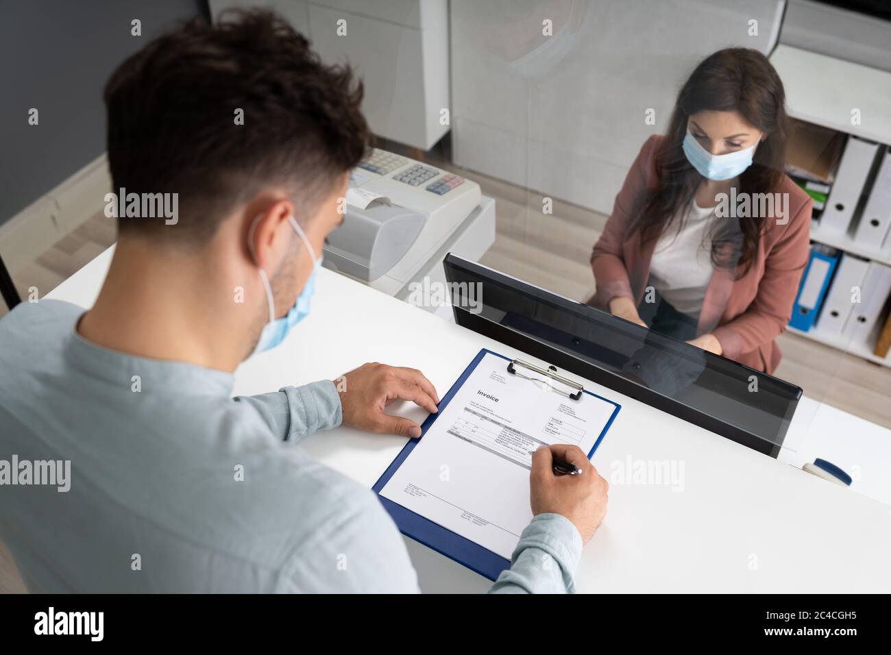 Hotel Reception Desk Protected By Medical Mask From Covid 19 Stock ...