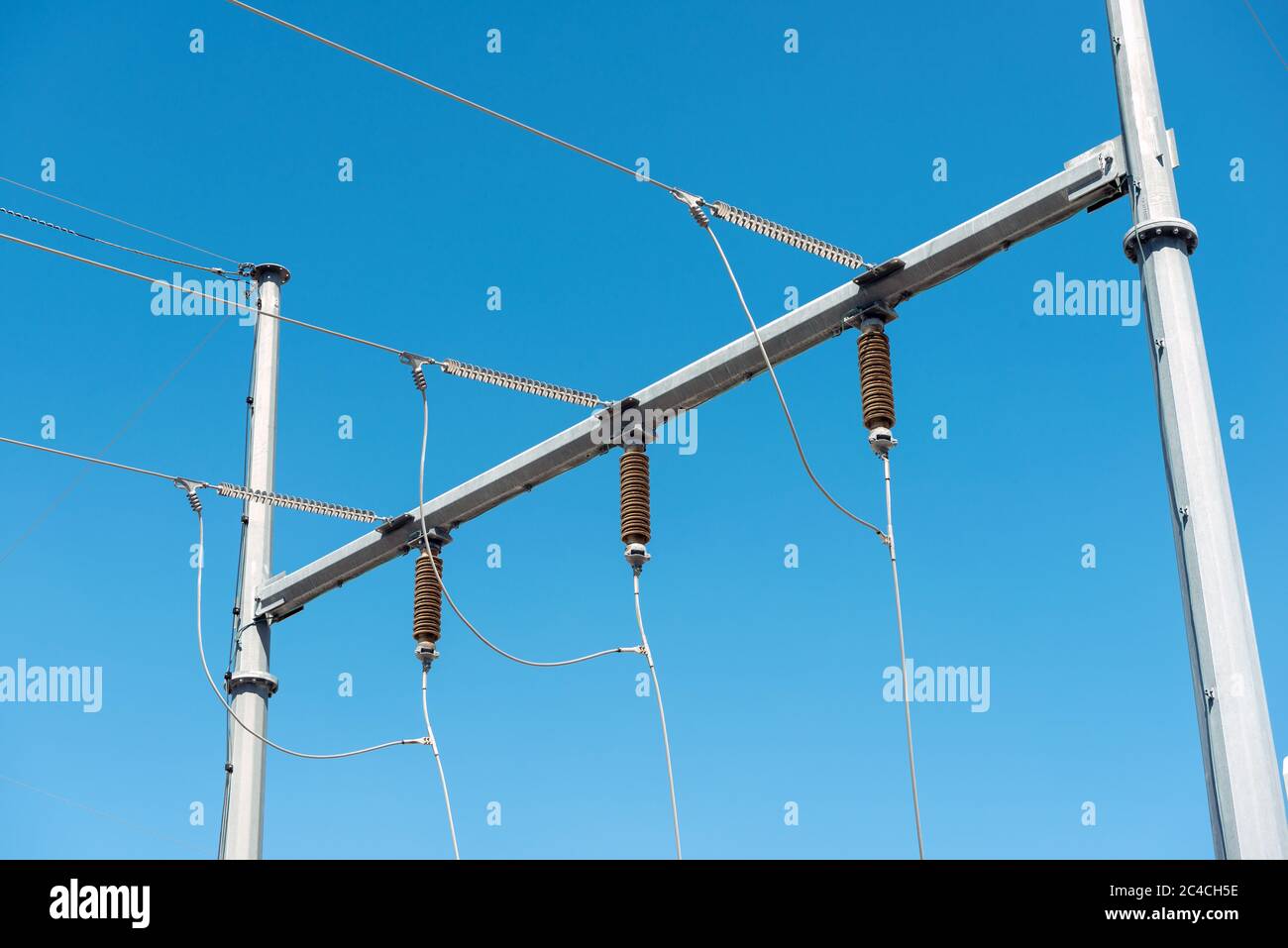 Electric power lines and insulators on a metal tower Stock Photo - Alamy