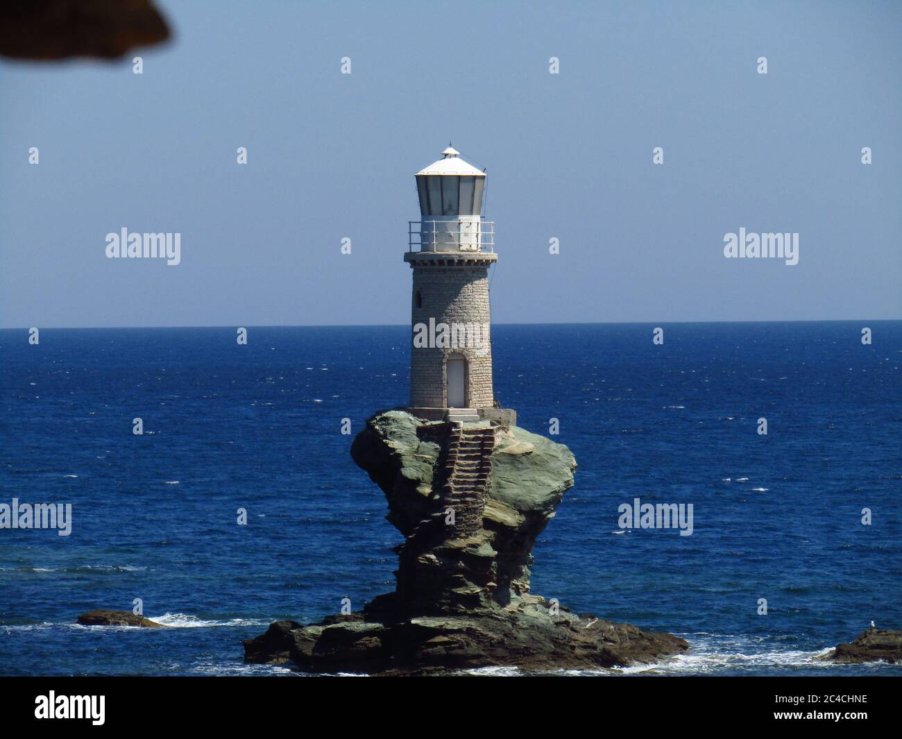 Beautiful view of the lighthouse of Tourlitis at Andros, Greece Stock ...