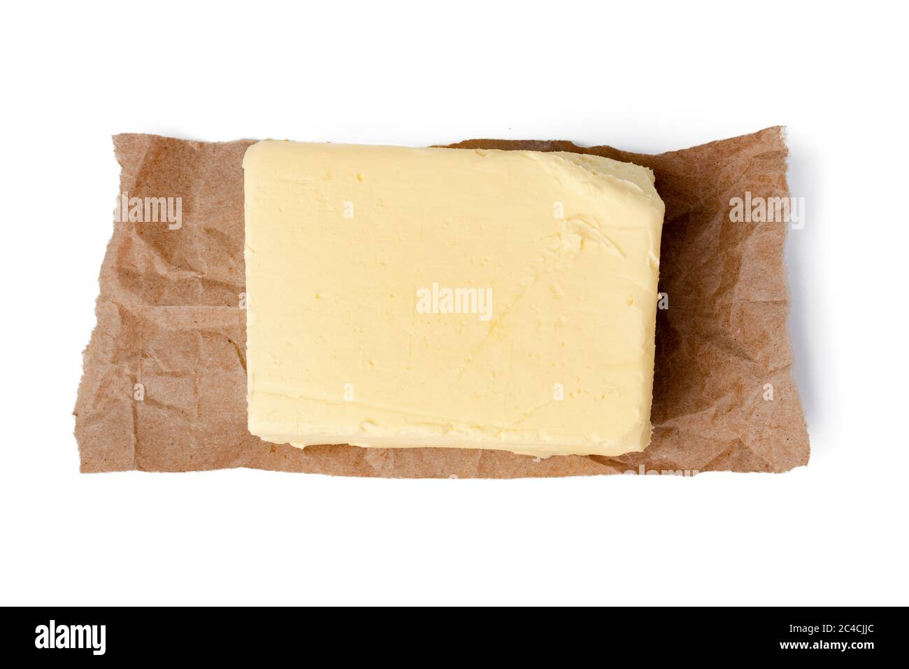 Fresh butter on craft paper isolated on white background Stock Photo ...