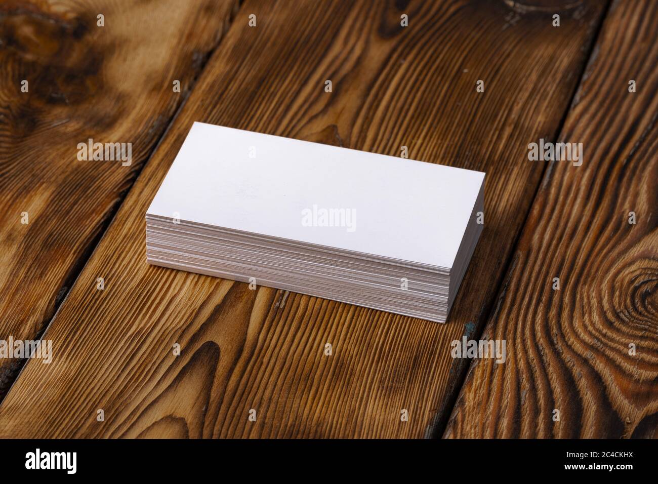 Stack of white business cards on brown wooden background Stock Photo ...