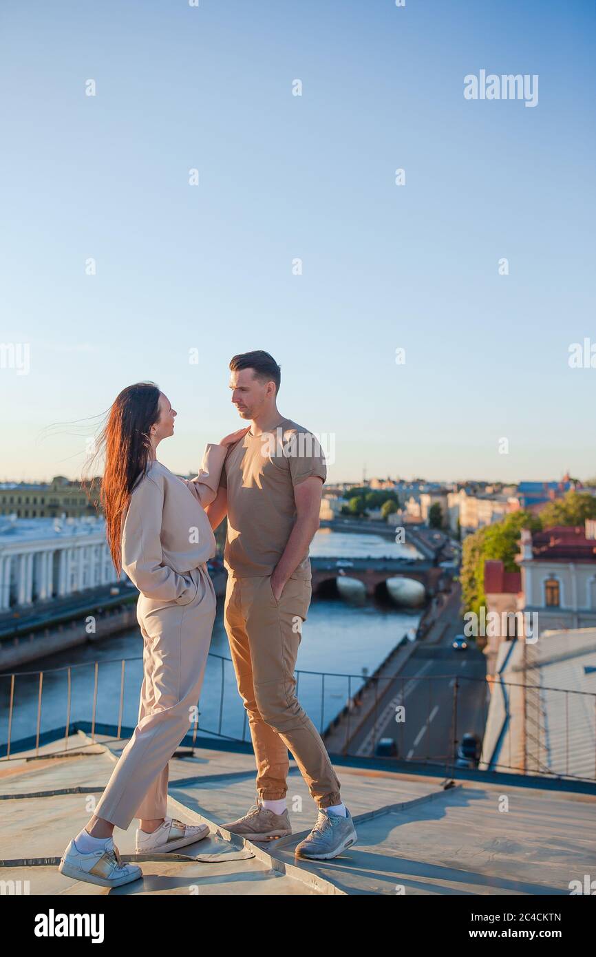 Family on rooftop enjoying with view of beautiful sunset in Sankt ...