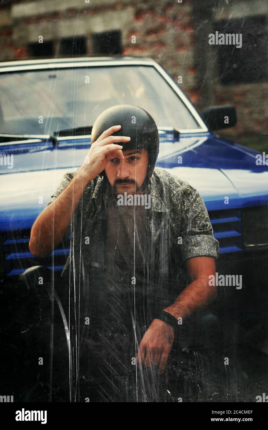 lifestyle young man with mustache, car, rock n roll Stock Photo - Alamy