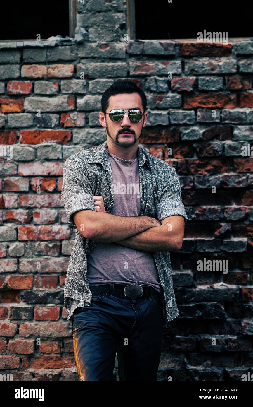 lifestyle young man with mustache, car, rock n roll Stock Photo - Alamy